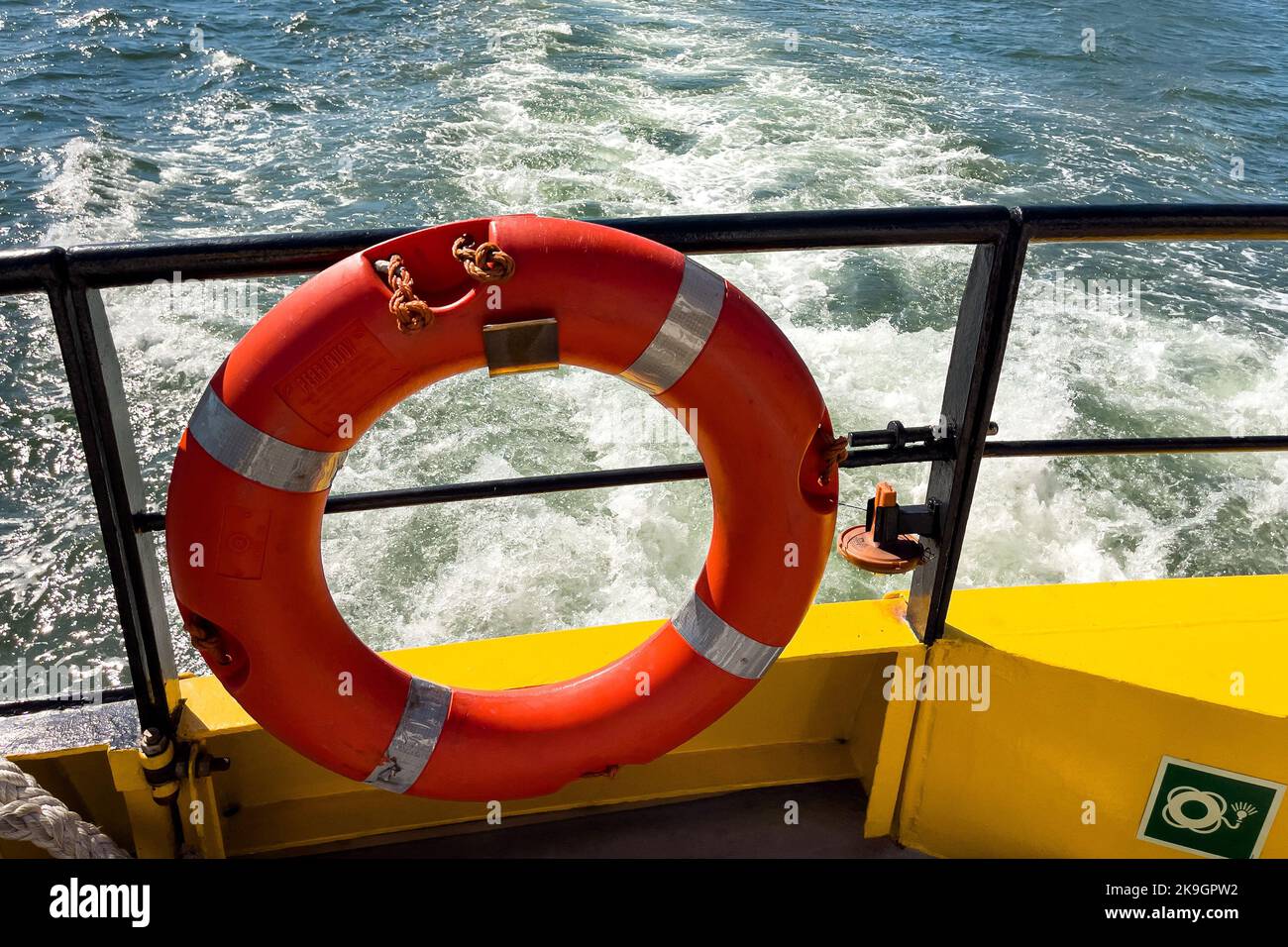 Orange rescue ring on a ferry boat Stock Photo - Alamy