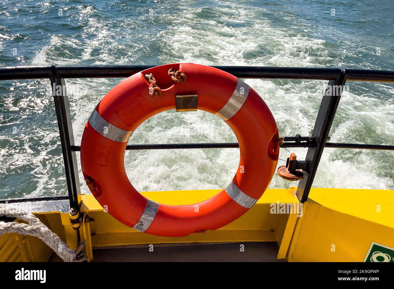 Orange rescue ring on a ferry boat Stock Photo - Alamy