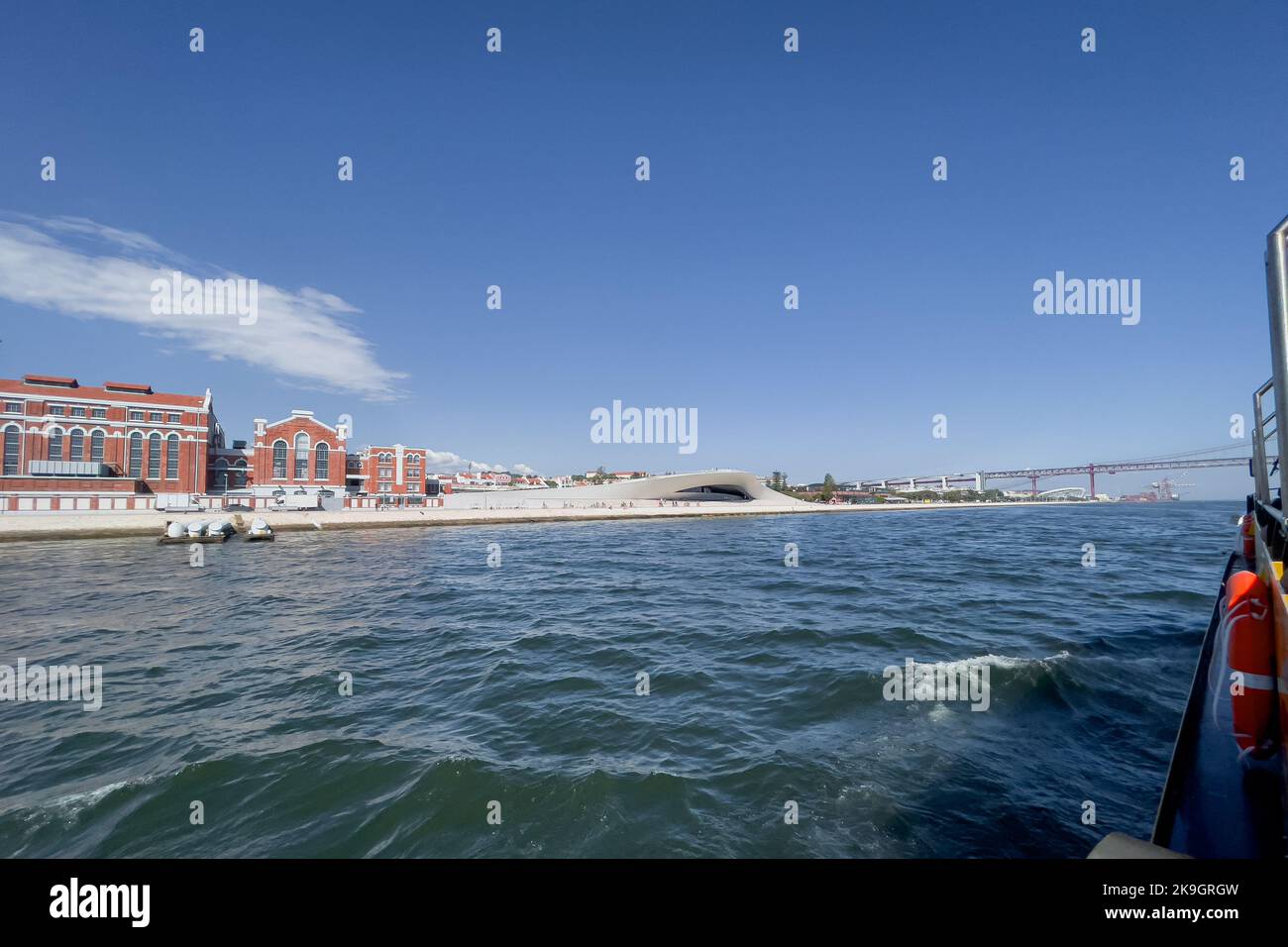 A view from a boat over Tejo power station beside MAAT Museum Stock ...