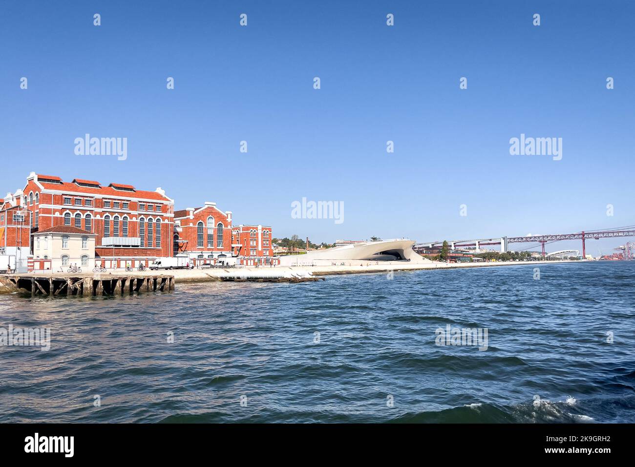 A view from a boat over Tejo power station beside MAAT Museum Stock ...