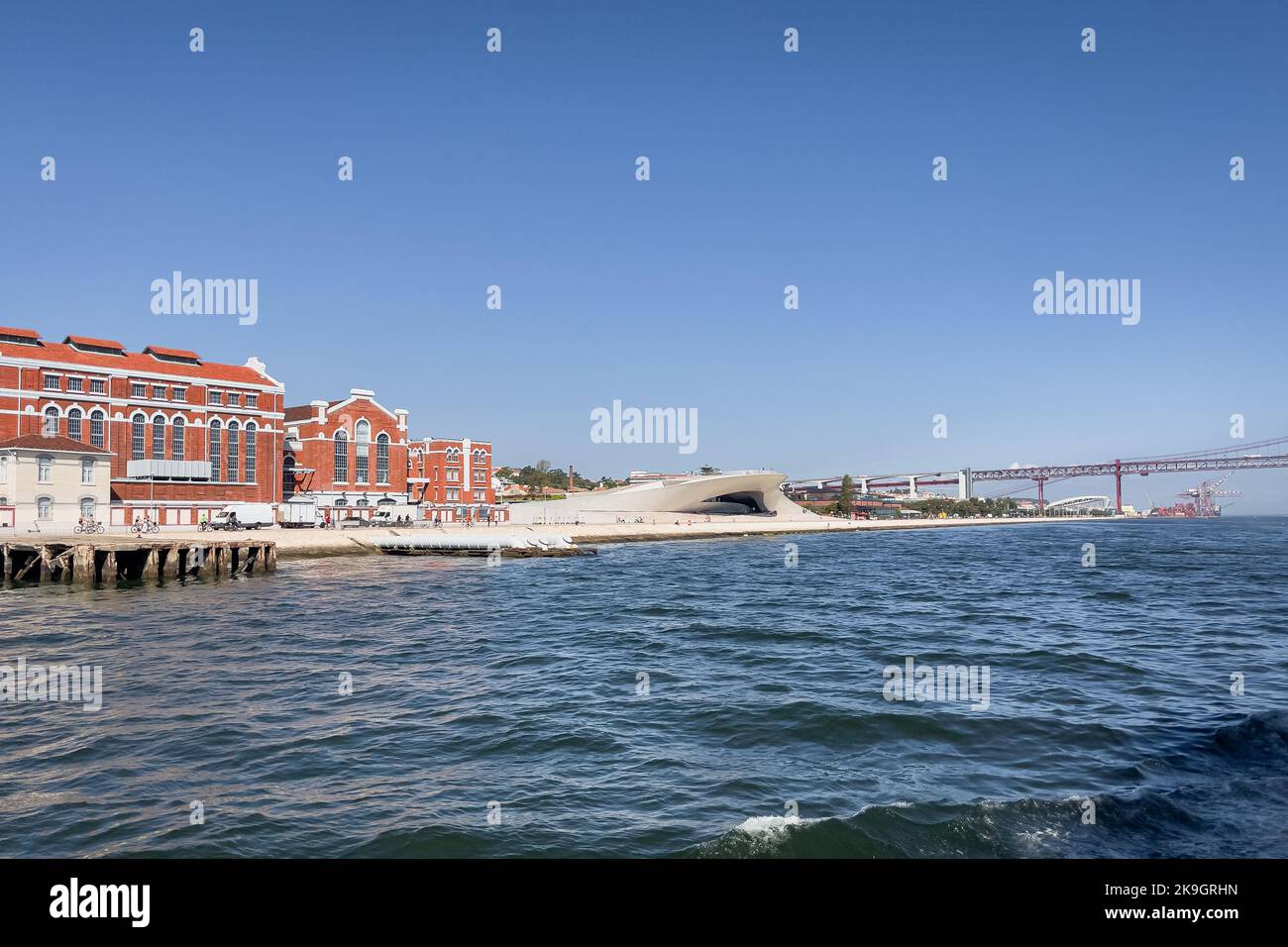 A view from a boat over Tejo power station beside MAAT Museum Stock ...