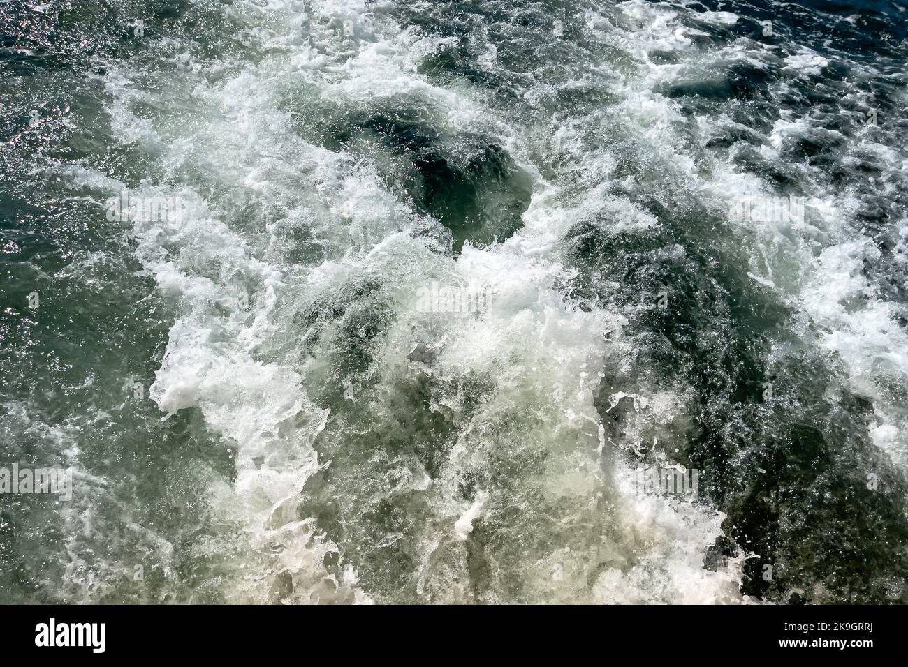A powerful waves shot from a fast moving boat Stock Photo - Alamy