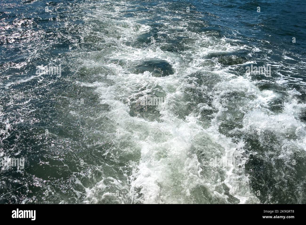 A powerful waves shot from a fast moving boat Stock Photo - Alamy
