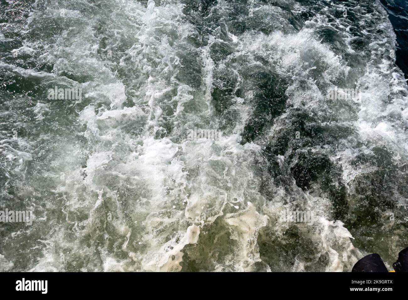 A powerful waves shot from a fast moving boat Stock Photo - Alamy