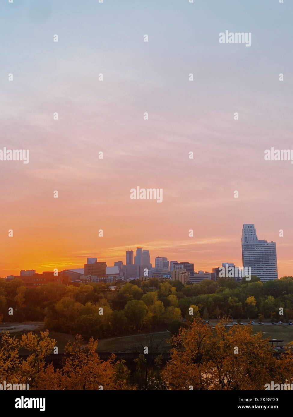 A scenic view of Minneapolis skyline on a beautiful sunset background ...