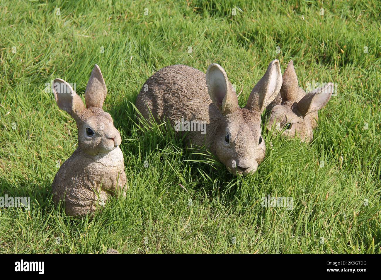 A Trio of Cute Rabbit Garden Ornaments Stock Photo - Alamy