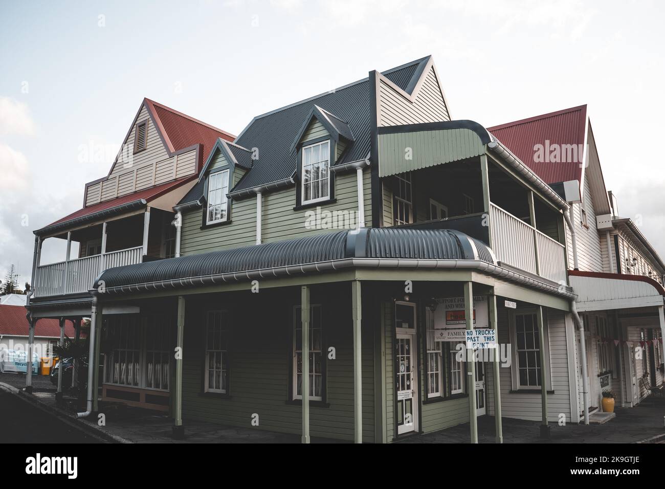 elegant wooden houses with nice old doors and windows on the corner of ...