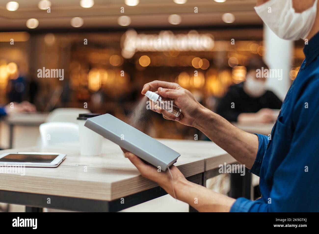 close up . young man treating personal belongings with antiseptic ...
