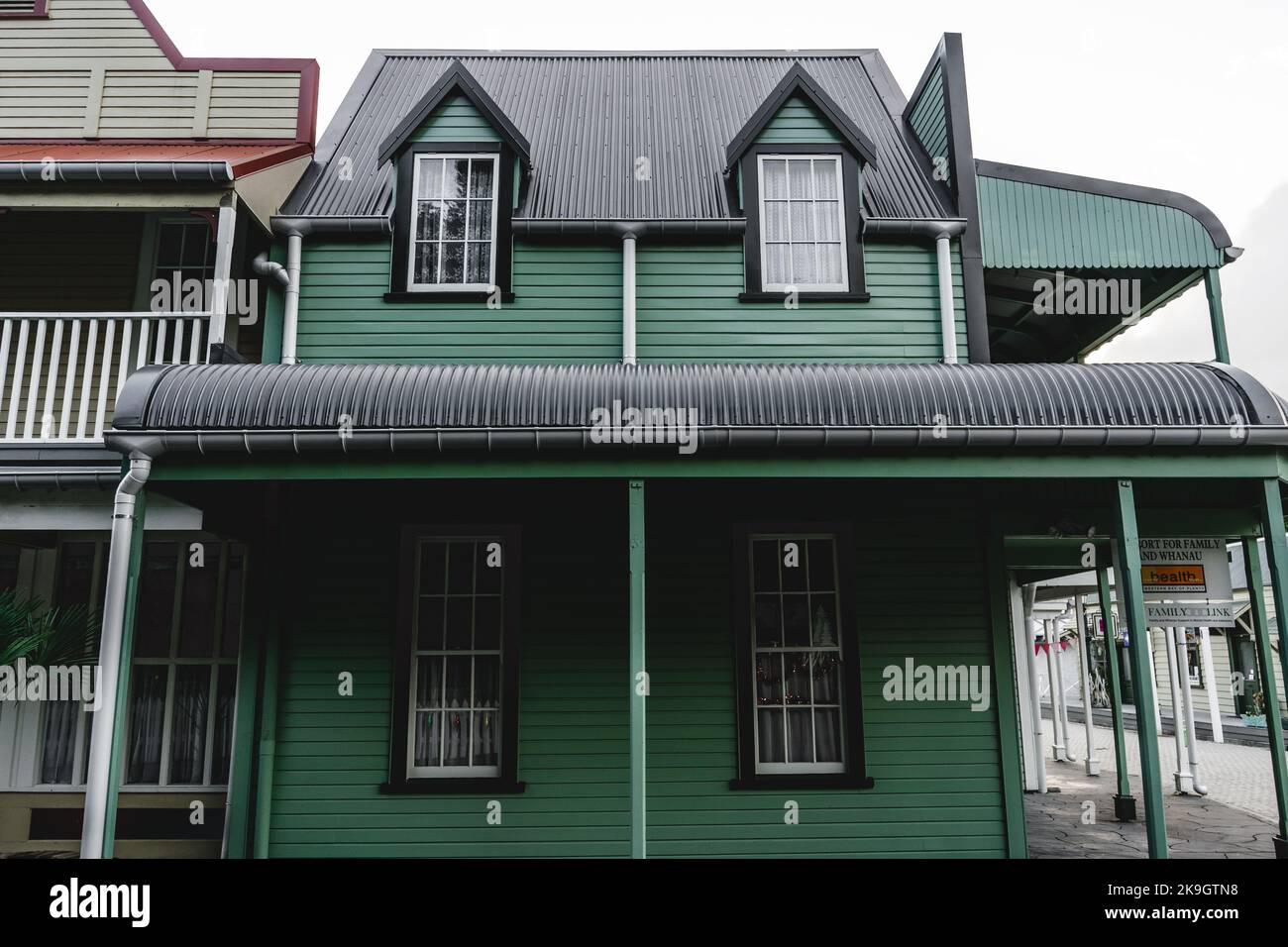beautiful elegant old wooden house with a triangular roof on a lonely ...
