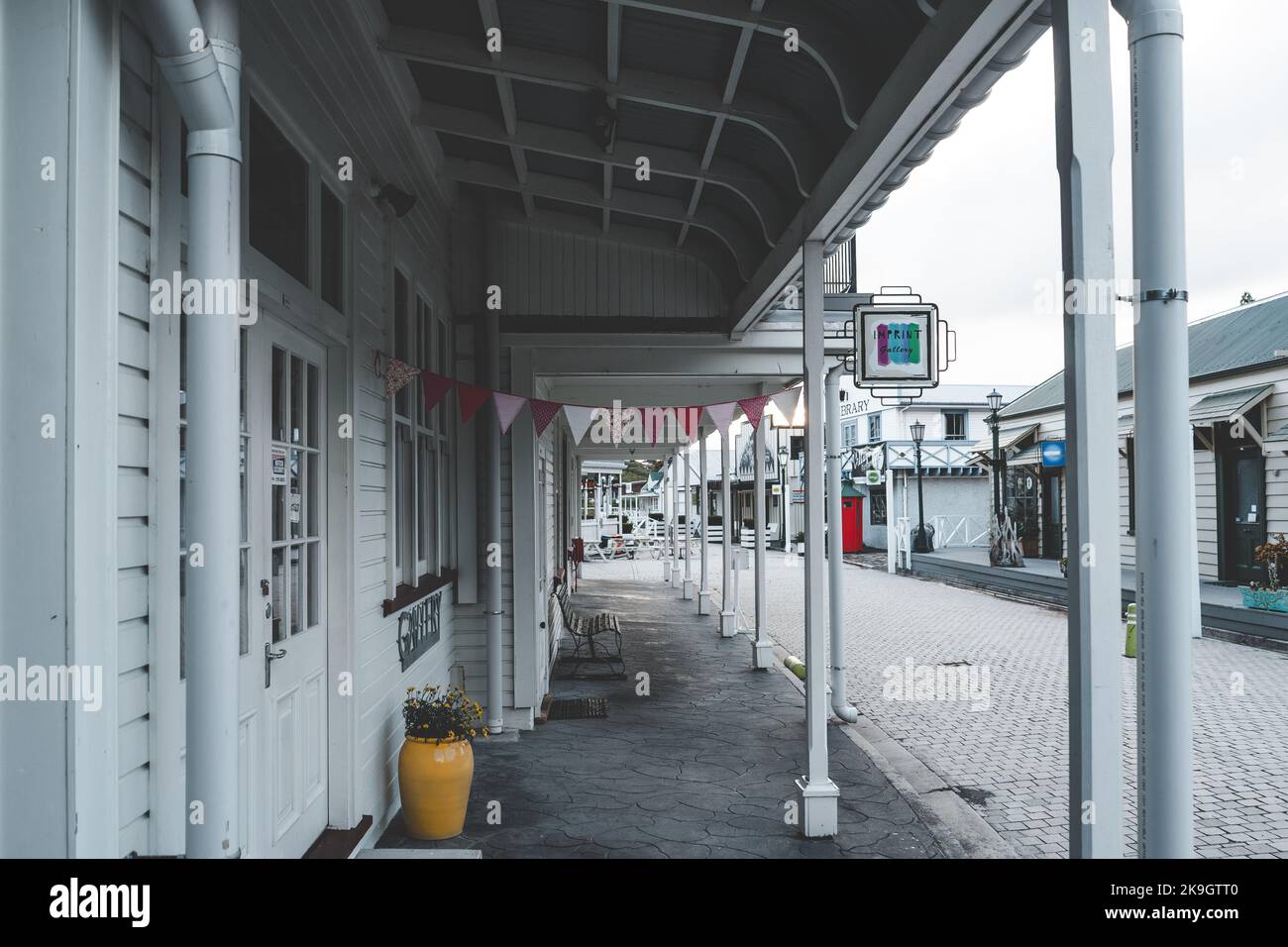 pretty street of a small town with wooden house facades and various ...
