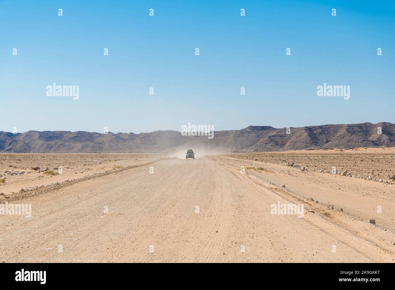 Car driving through desert road hi-res stock photography and images - Alamy