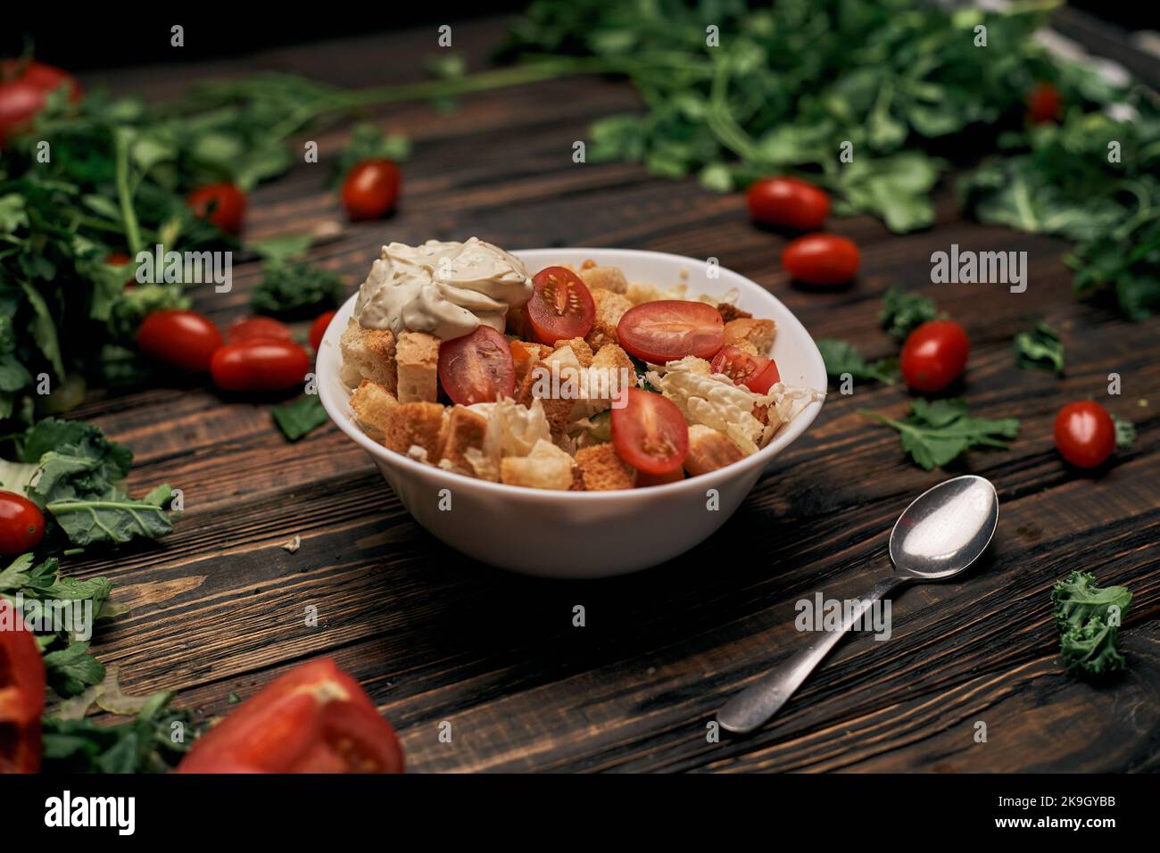 spoon and vegetable salad with crackers on the table Stock Photo - Alamy