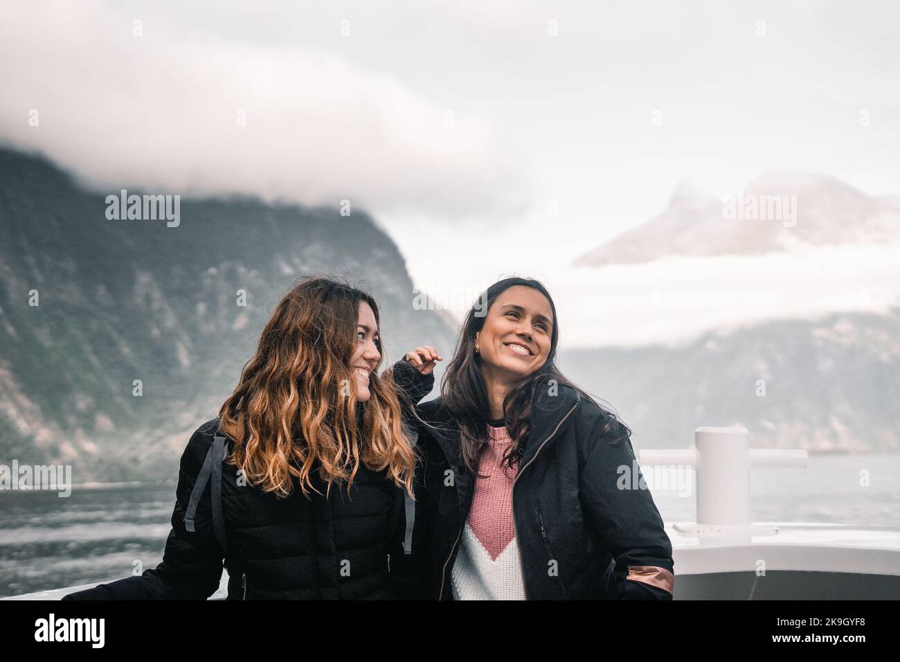 two young caucasian girls with long hair one blonde and one brunette ...