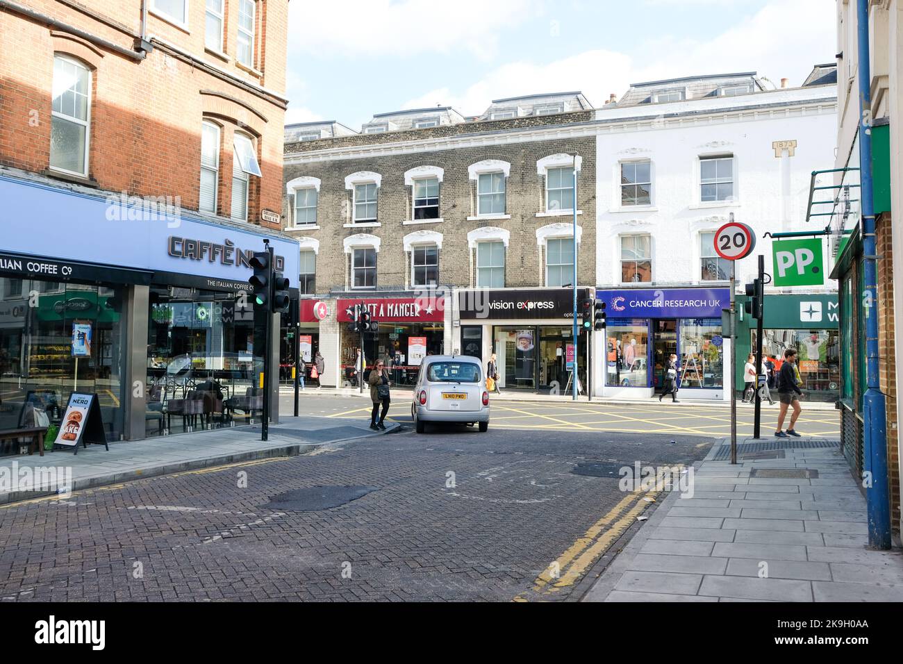 London- October 2022: Caffe Nero and other high street shops on Putney ...