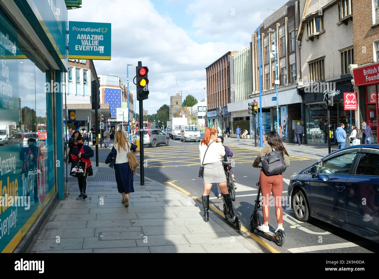 London- October 2022: Street scene of shoppers and shops on Putney High ...