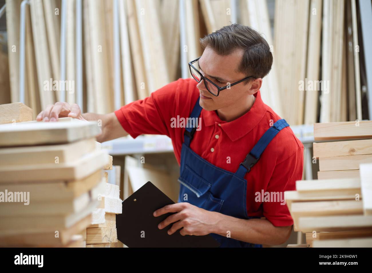 floor coverings store supervisor checking the marking on the packages ...