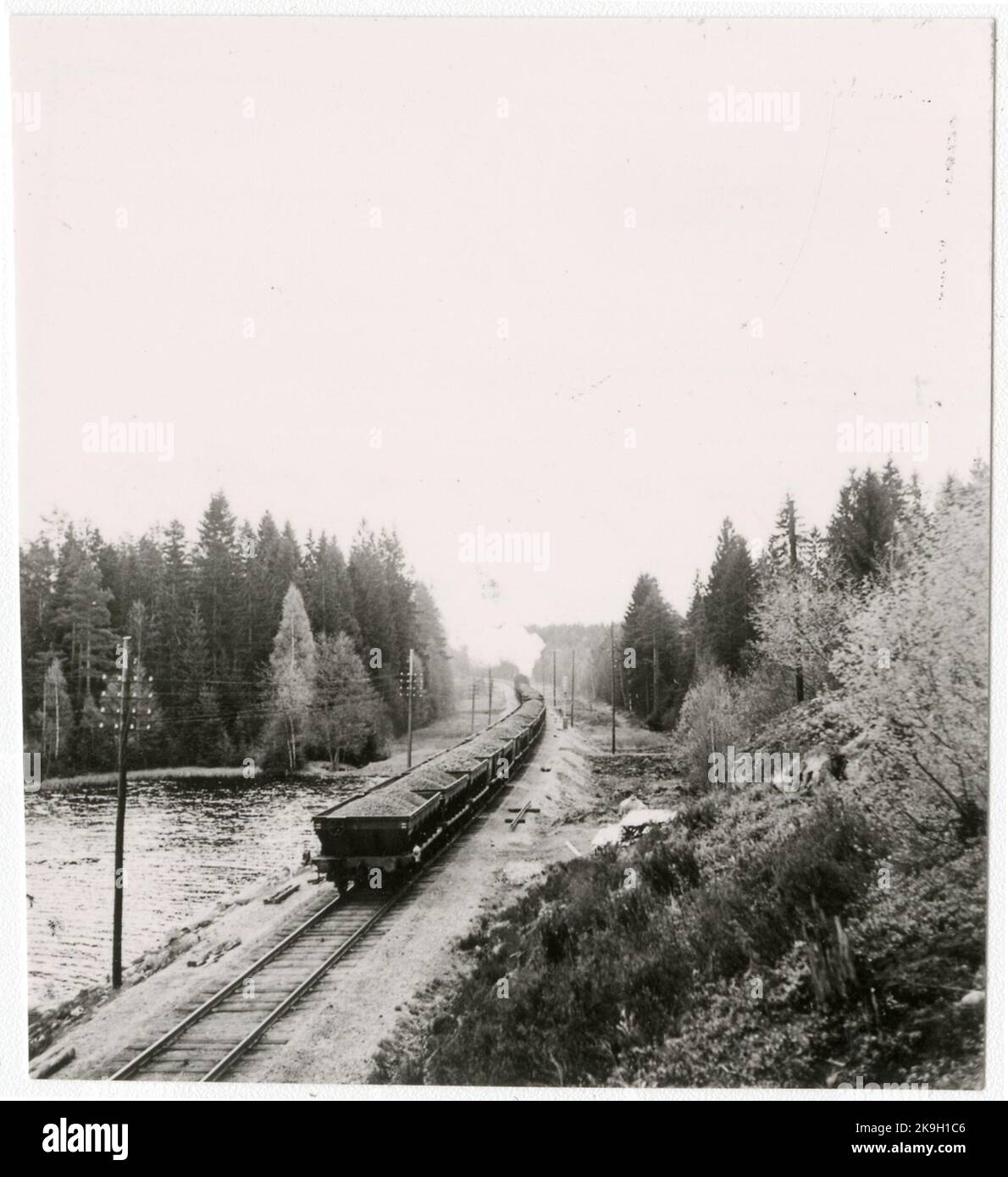 An ore train is drawn by a steam locomotive from Trafikaktiebolaget ...