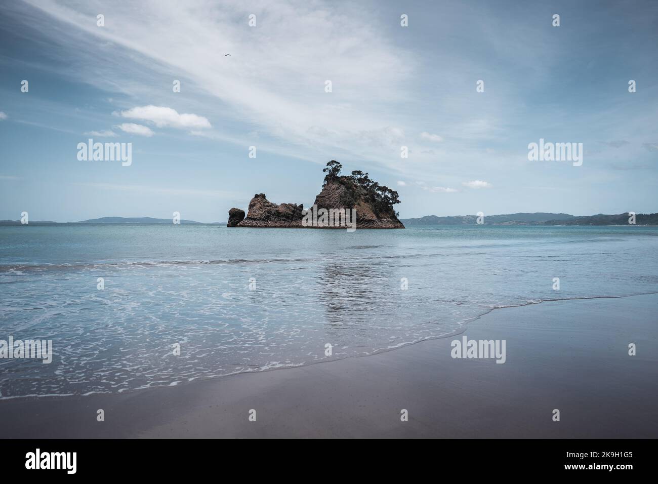 island and waves of calm sea in new chums Stock Photo - Alamy