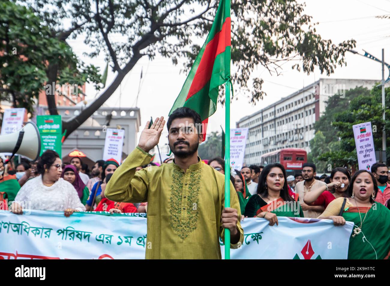 Member secretary Nurul Haque Nur holds a Flag of Bangladesh during the ...