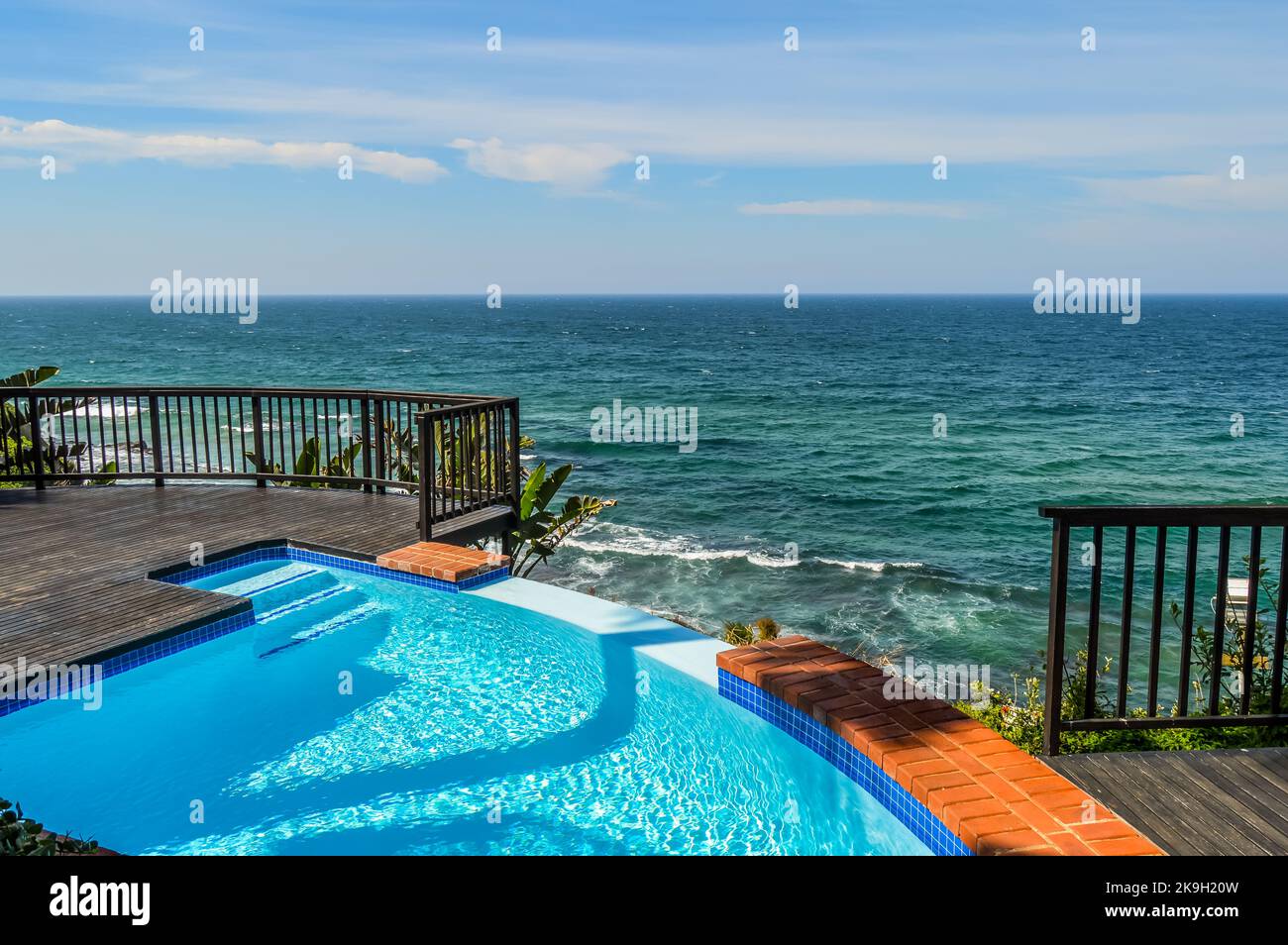 Outdoor jacuzzi and luxurious spa bath and infinity pool along Atlantic ...
