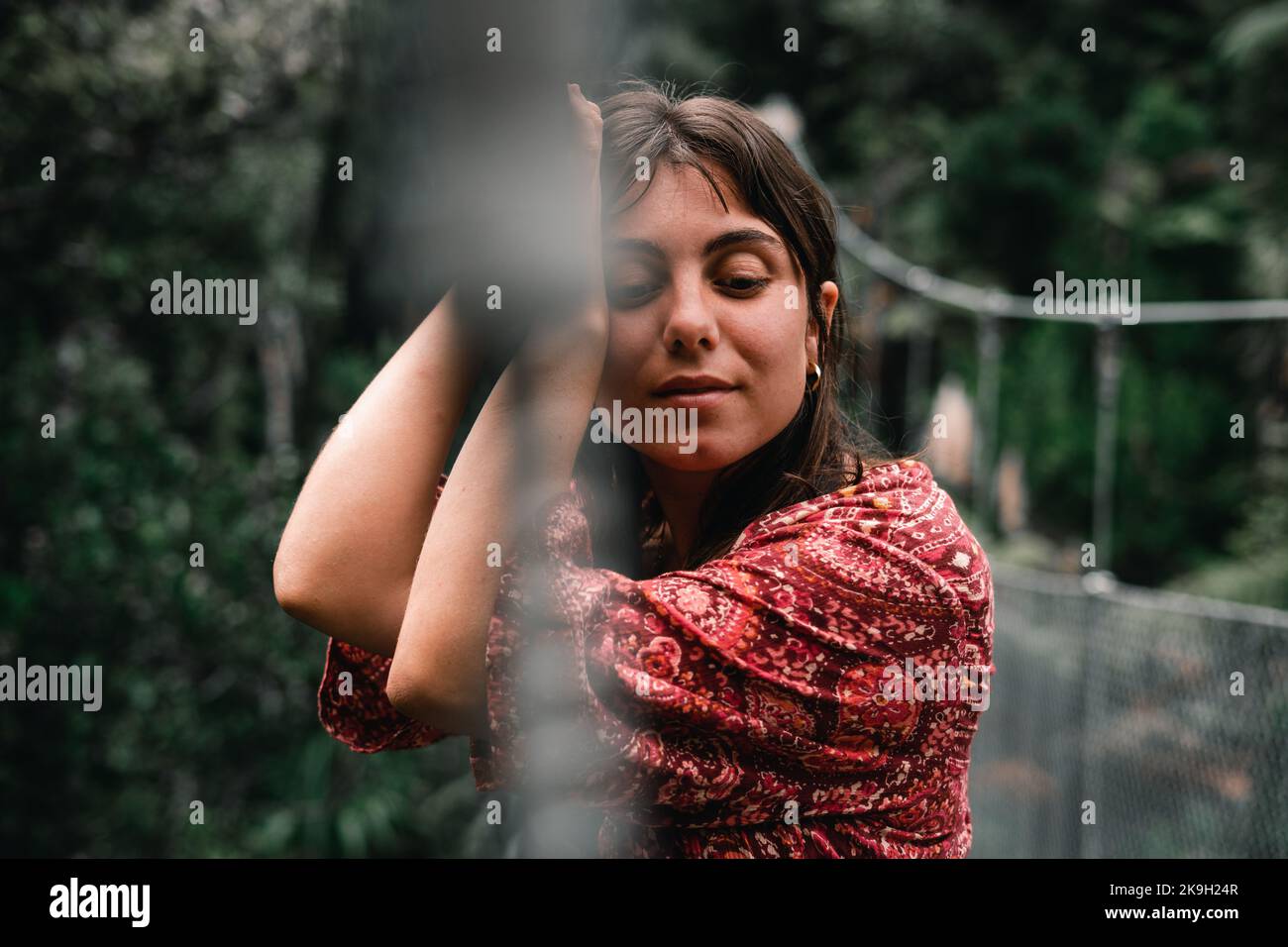 disheveled blue-eyed caucasian young woman with a narrow nose looking ...