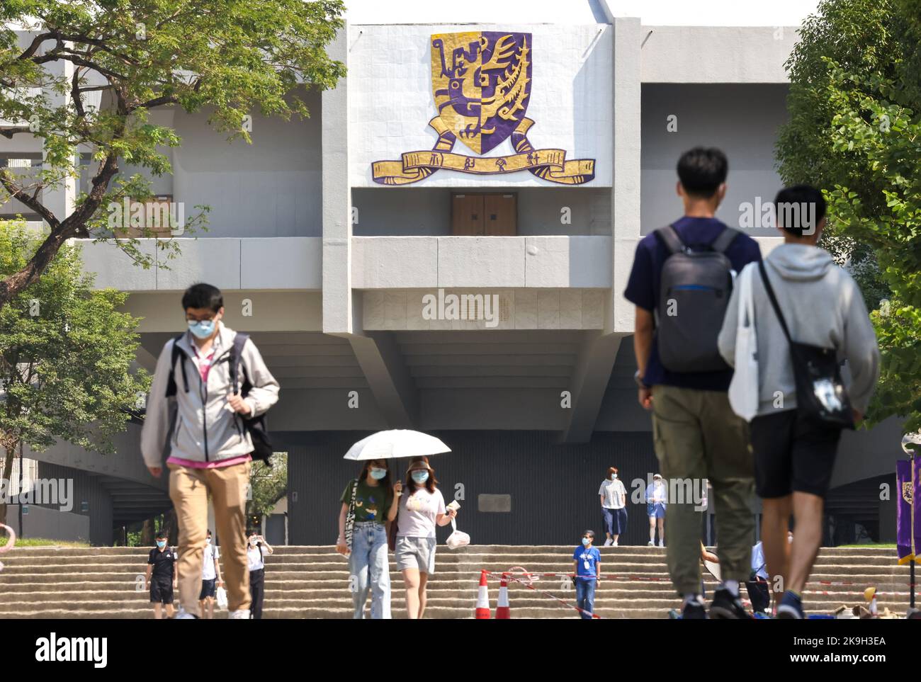 Chinese University of Hong Kong crest is displayed on the wall of ...