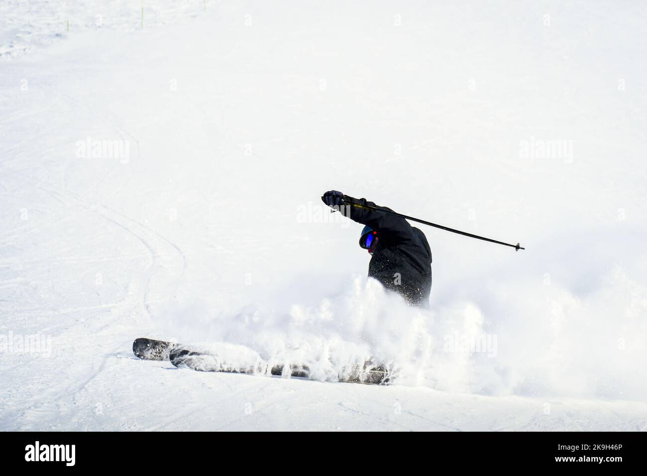 Dynamic picture of a skier on the piste in Alps. Woman skier in the ...