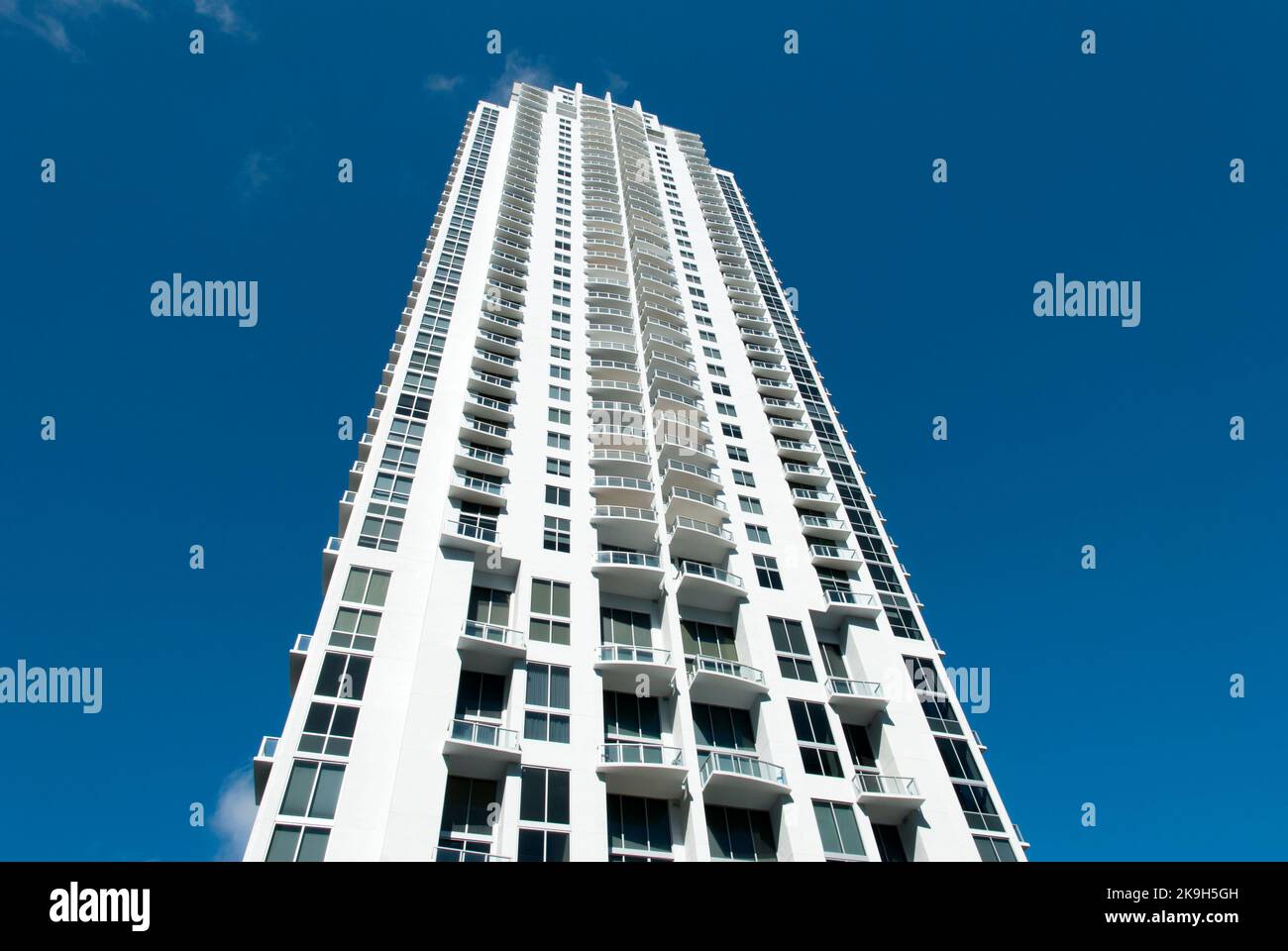 The white tall tower of residential building in Miami downtown (Florida ...