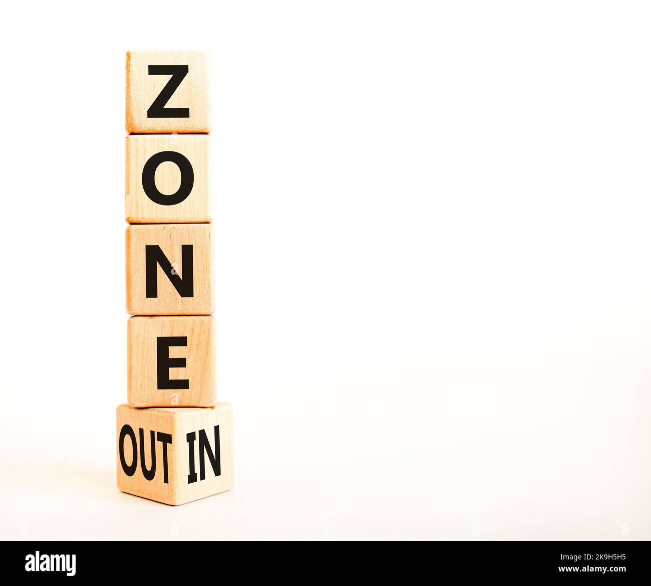 Zone in or out symbol. Concept words Zone in and Zone out on wooden ...