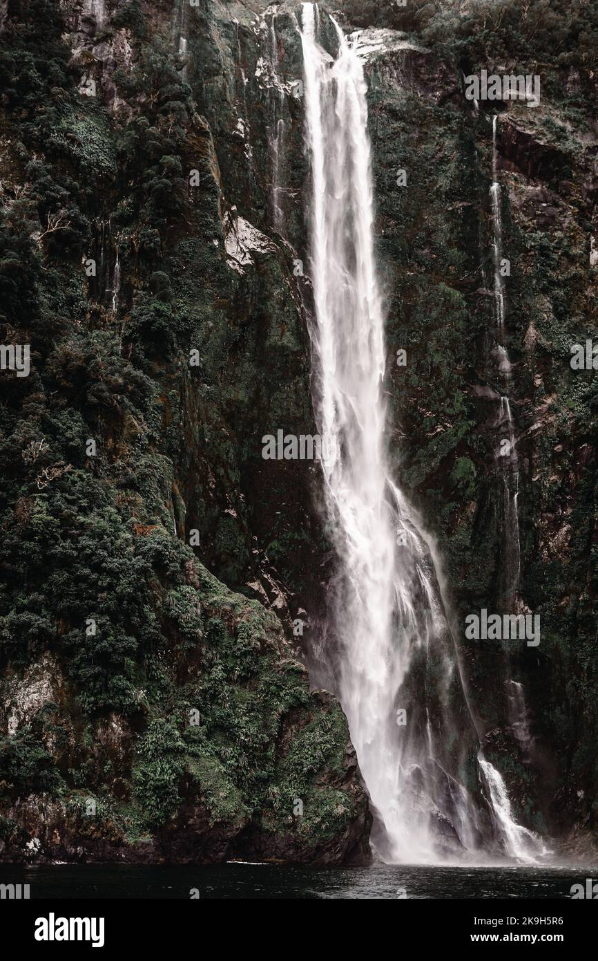 impressive waterfalls falling with force between the jungle trees and ...