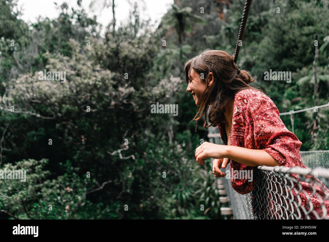 caucasian girl with messy brown hair relaxed smiling leaning on the ...