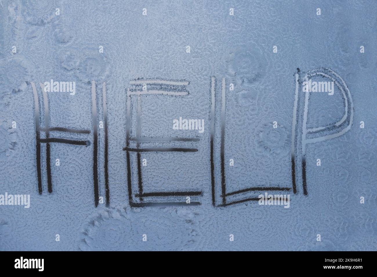 The "Help" inscription on a snowy window. Finger written Stock Photo ...
