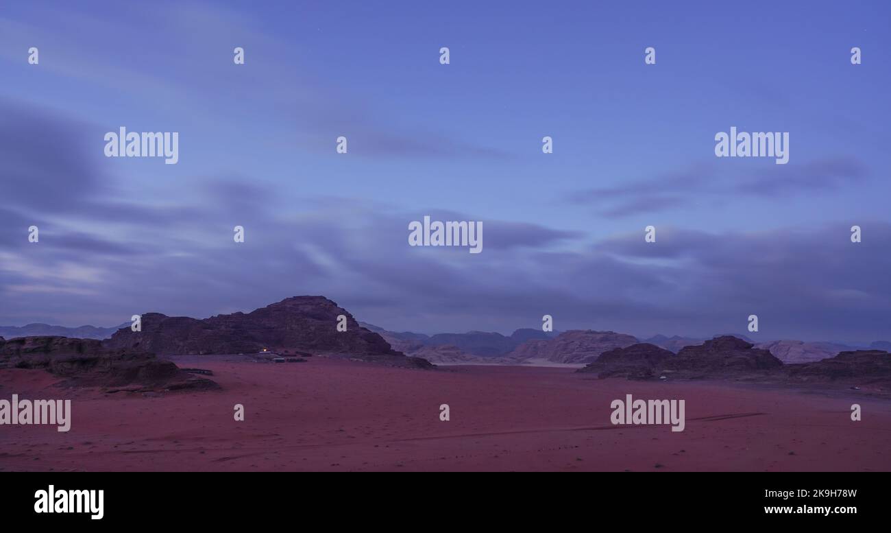 Rocky scenery in Wadi Rum desert during early overcast morning, camp ...