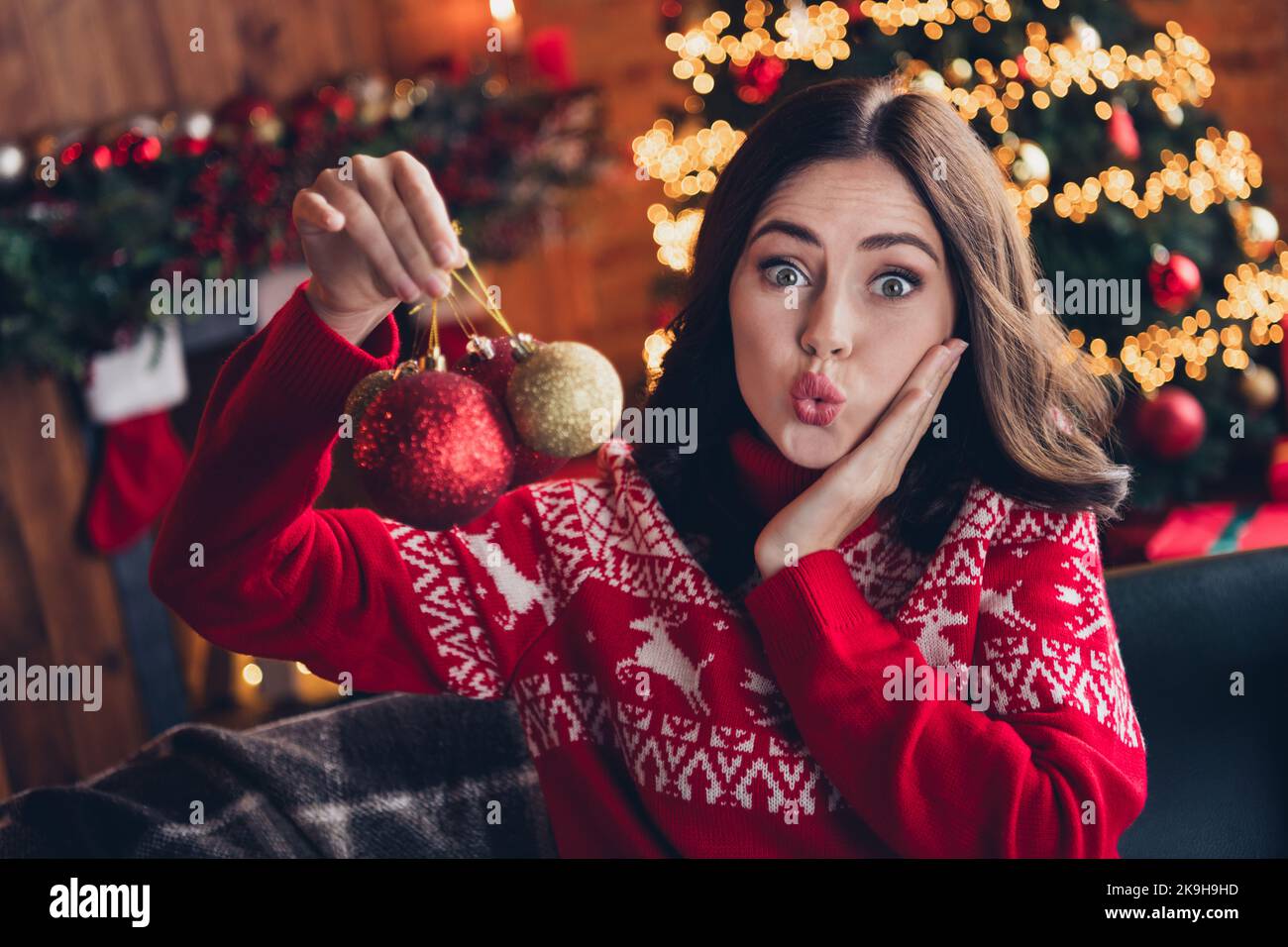 Portrait of impressed pretty girl pouted lips hand touch cheek hold ...