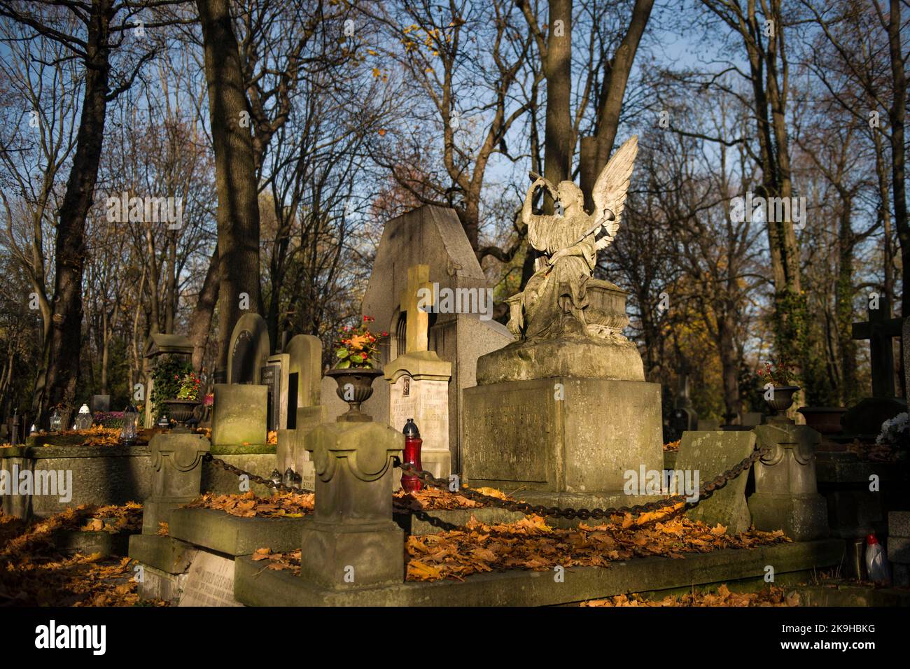 A sculpture of an angel seen among the graves at the historic Powazki ...