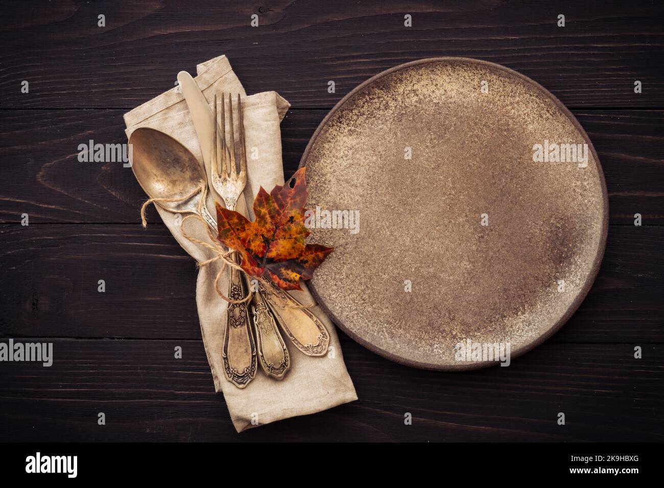 Fall table setting at dark background top view Stock Photo - Alamy