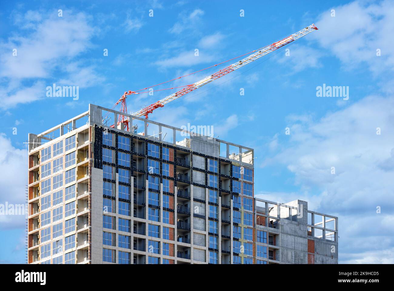 Construction of a modern multi-storey residential building and cladding ...