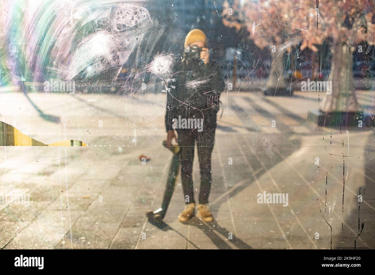 Reflection in mirror. Murky mirror outside. Self-portrait of ...