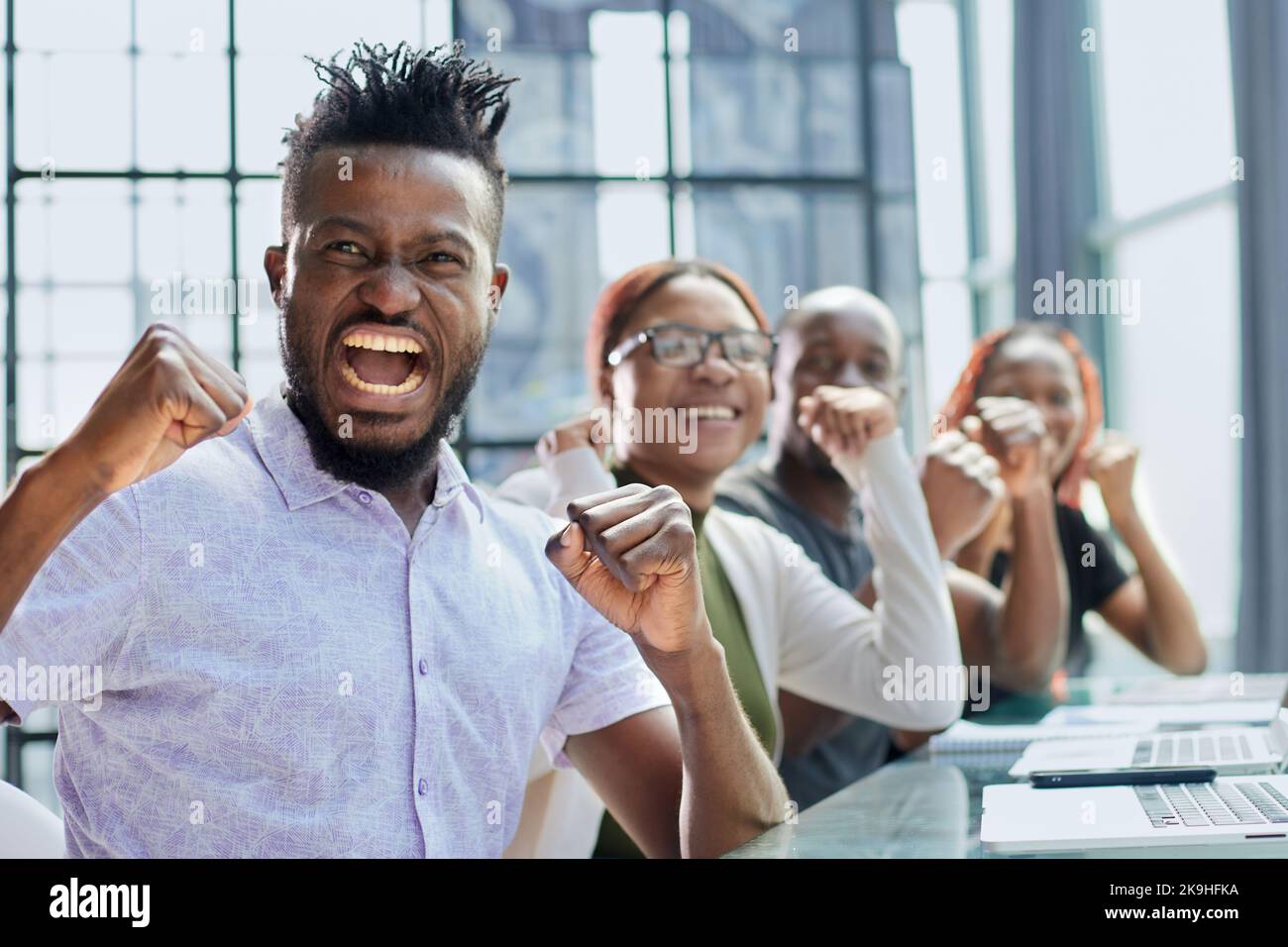 business team celebrating their success. good deal Stock Photo - Alamy