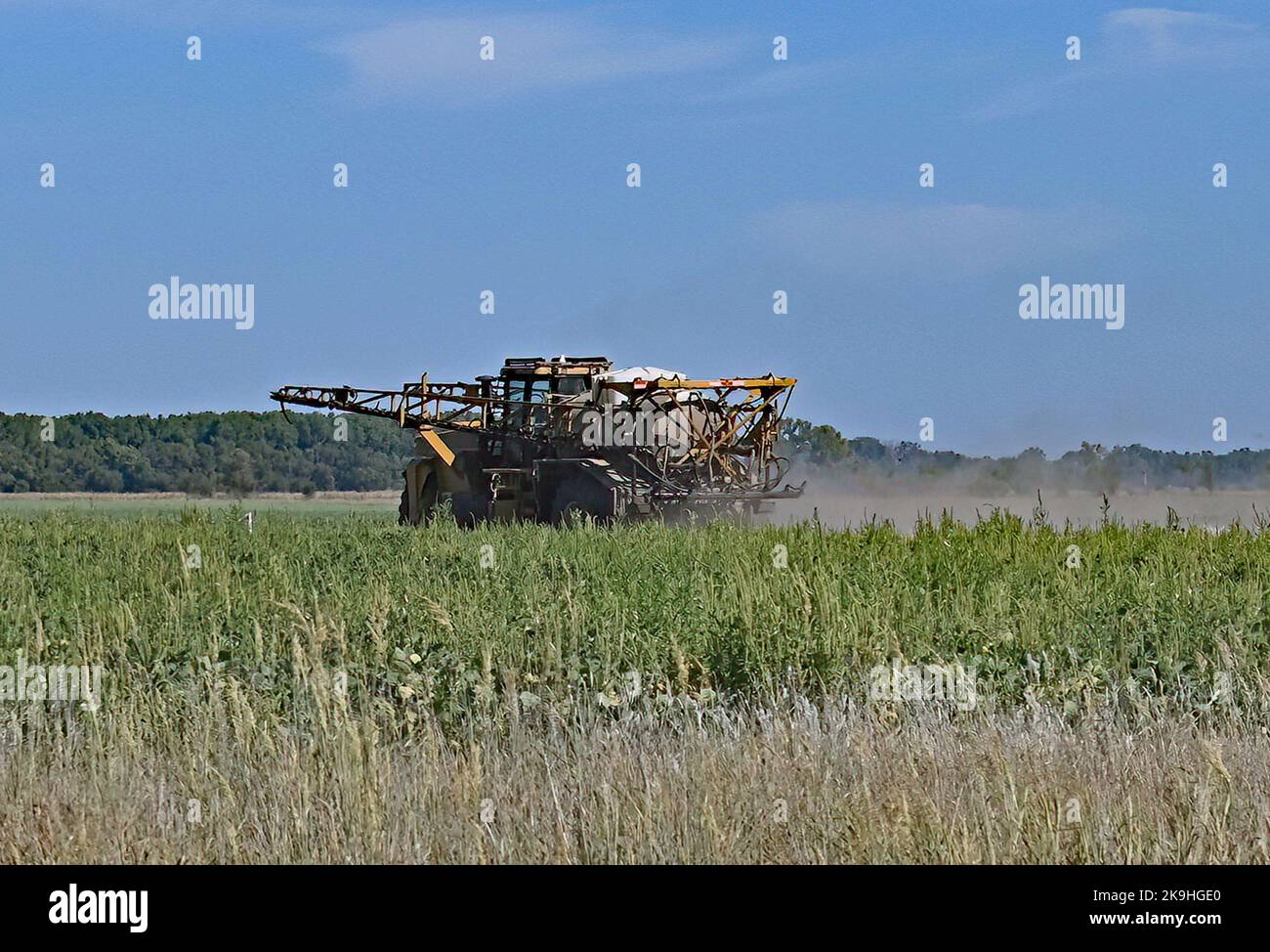 CANTON, KANSAS - SEPTEMBER 19, 2022Farm worker spraying a recently cut ...