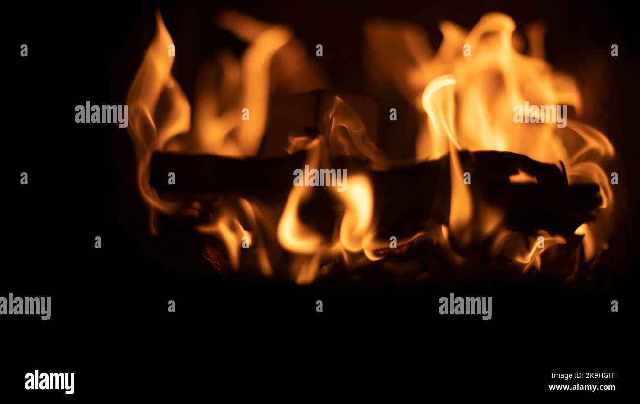 Firewood burning in fire. Flame in furnace. Hearth in house. Fireplace ...