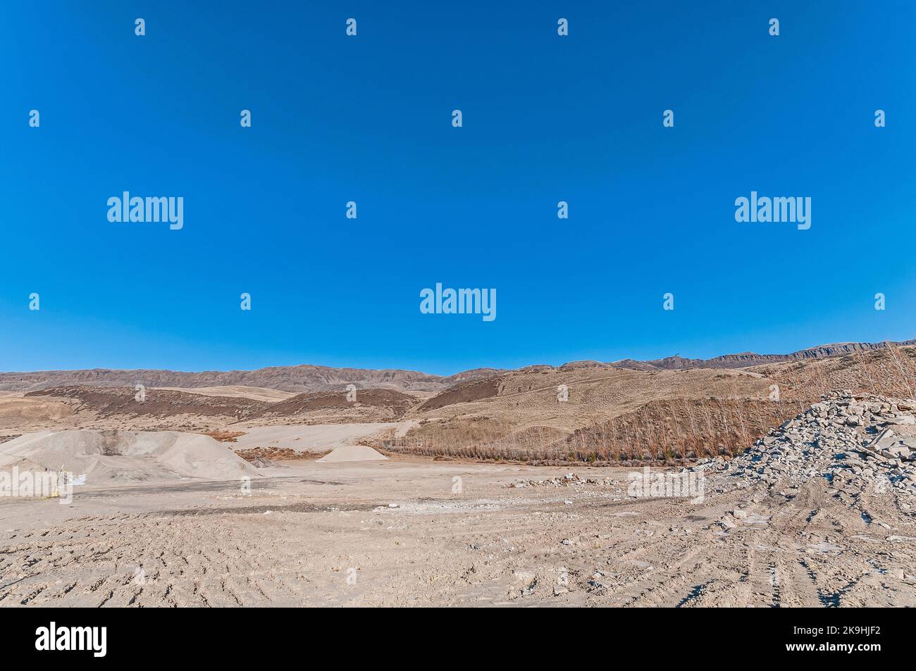 Tire and tread tracks are quite evident in the soil of an active solid ...