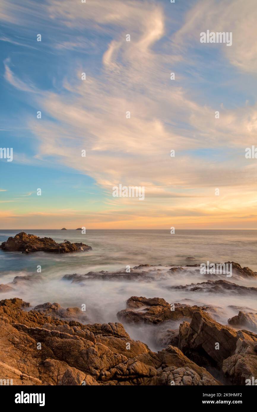 A breathtaking photograph captures the beauty of a rocky coastline ...