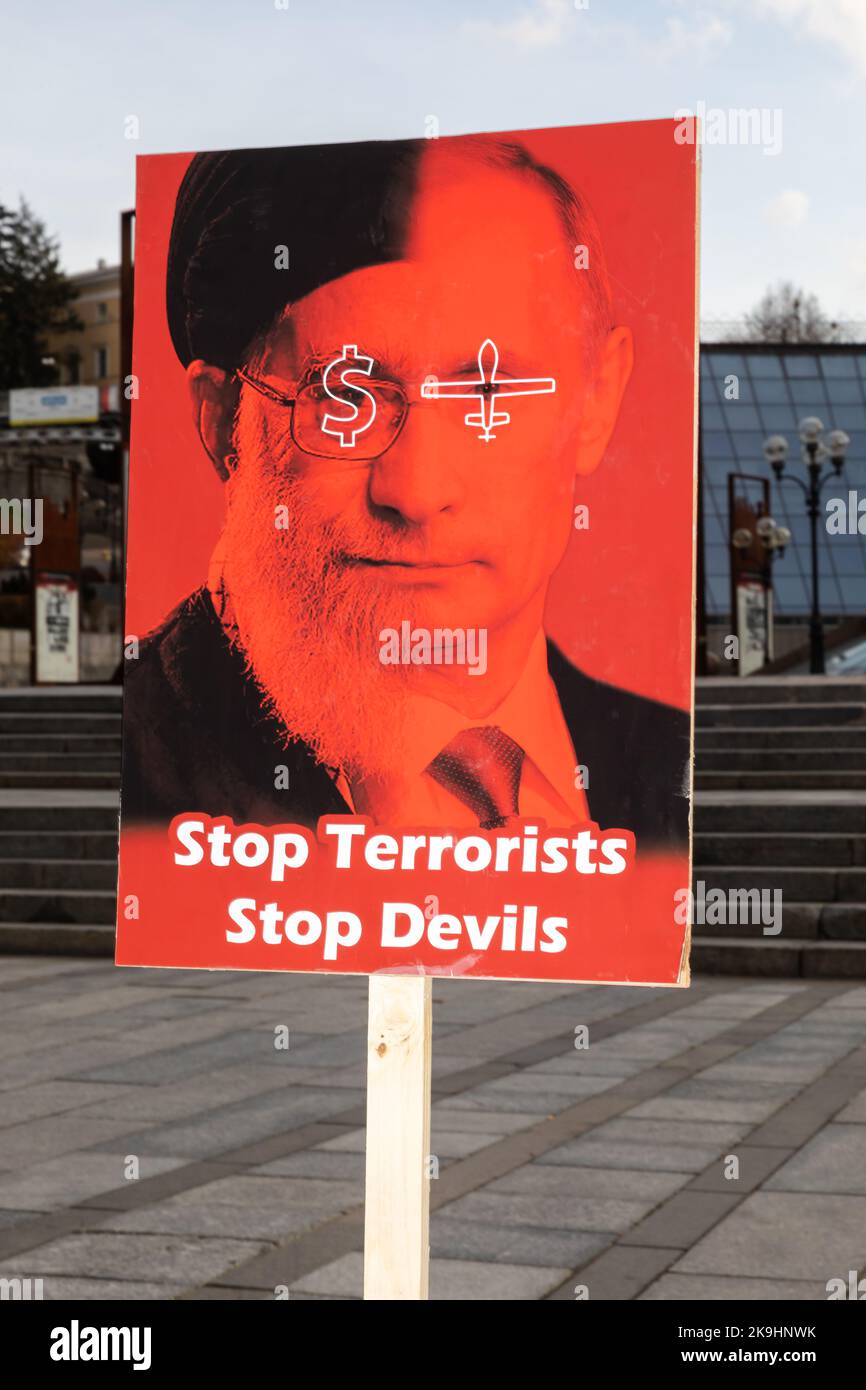 A placard with a portrait composed of the faces of Vladimir Putin and ...