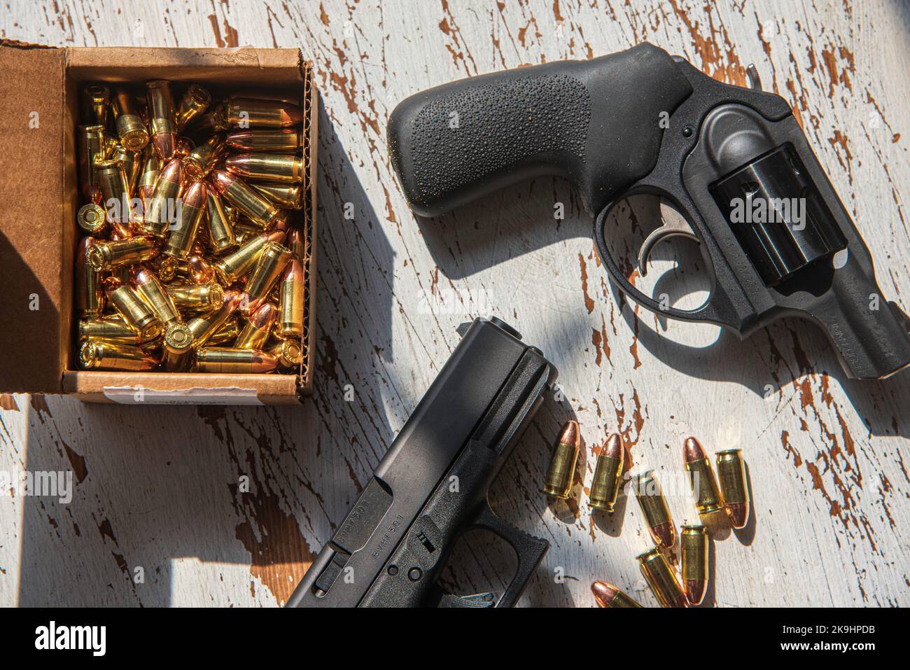 A black, Glock 19, 9mm, pistol and a Ruger, 9mm, snub nosed, revolver ...