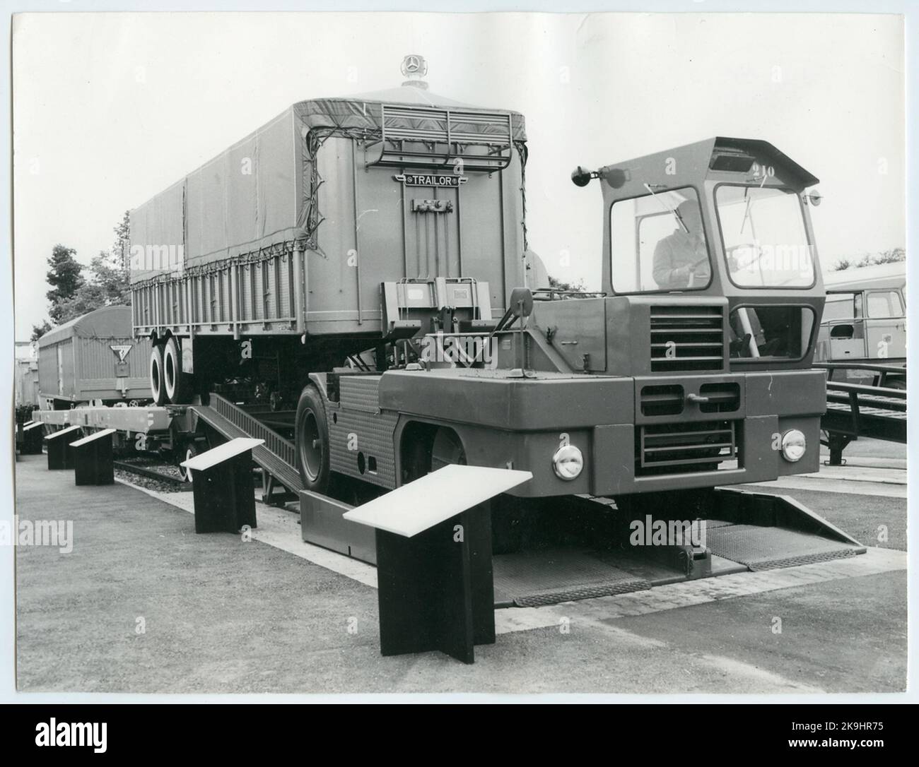Truck backs up trailer on ramp Stock Photo - Alamy