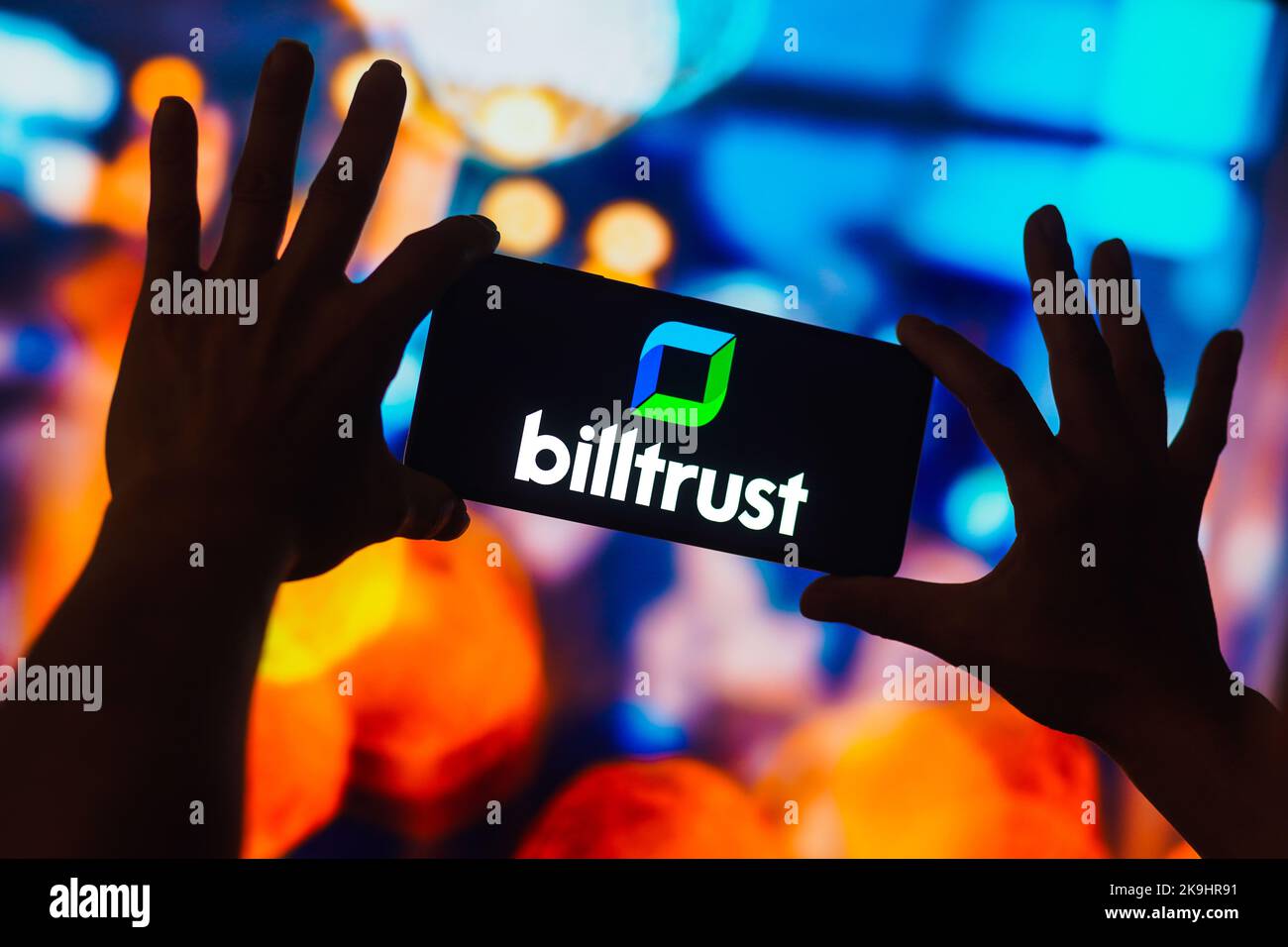 In this photo illustration, the Billtrust logo is displayed on a ...