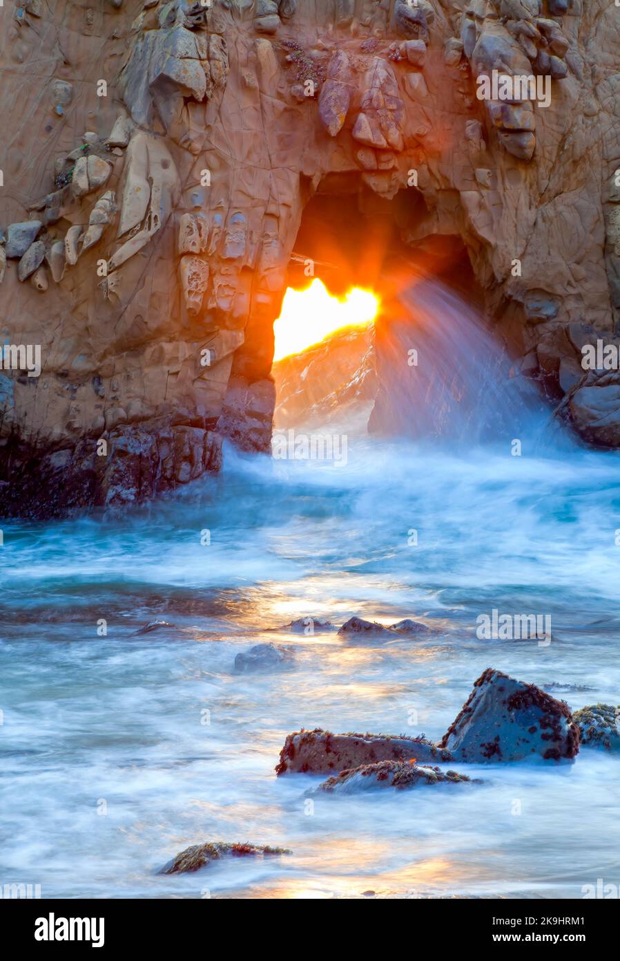 A stunning photograph captures the golden glow of a setting sun as it ...