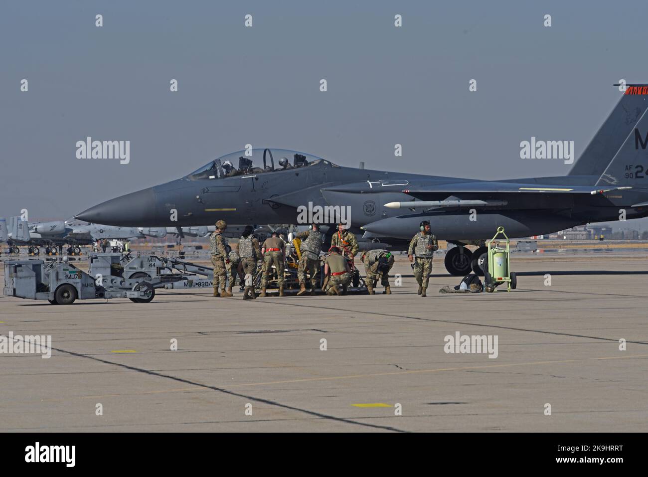 U.S. Airmen with the 366th Munitions Squadron prepare to load munitions ...