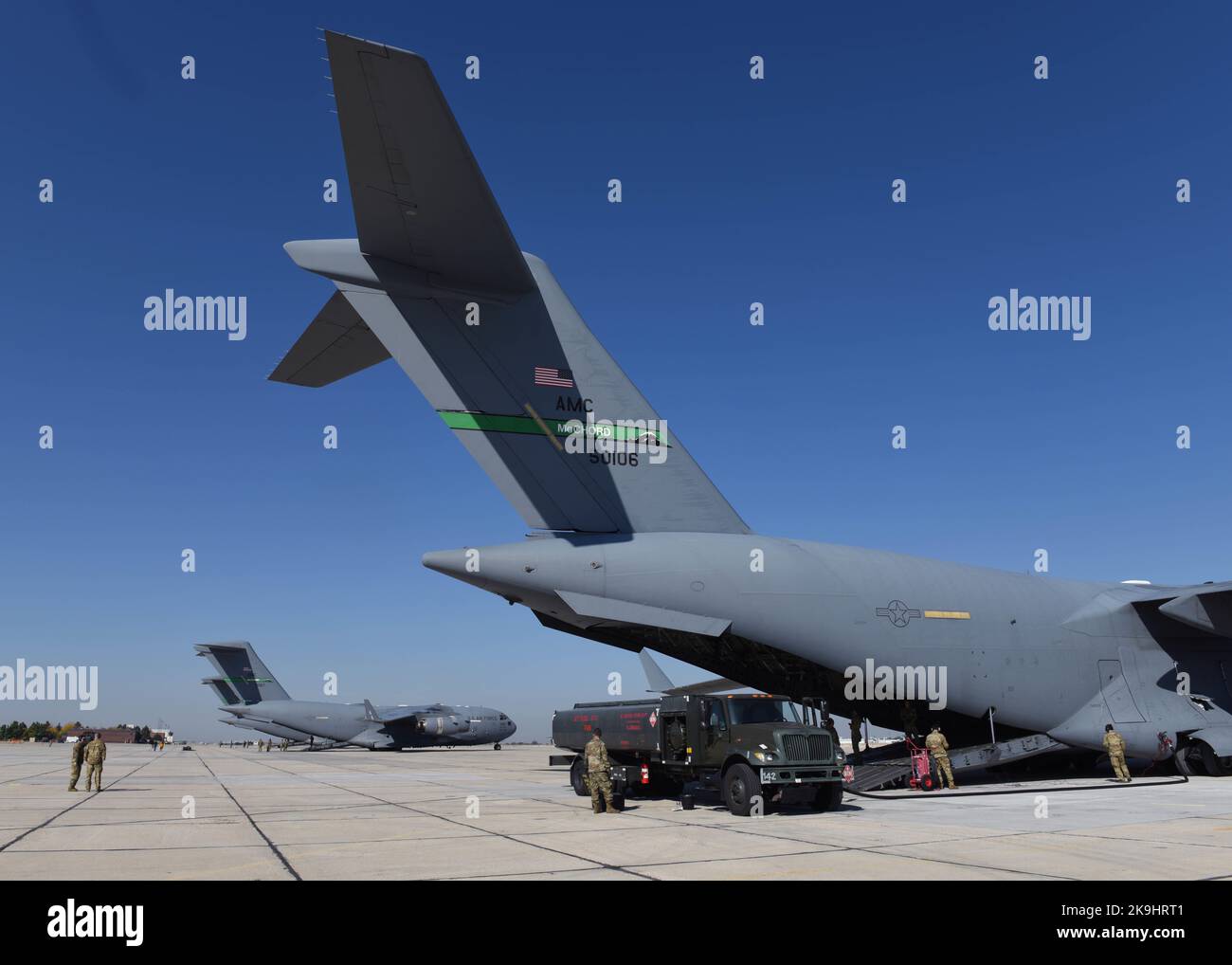 U.S. Airmen with the 62d Airlift Wing and 627th Air Base group perform wet wing refueling ...